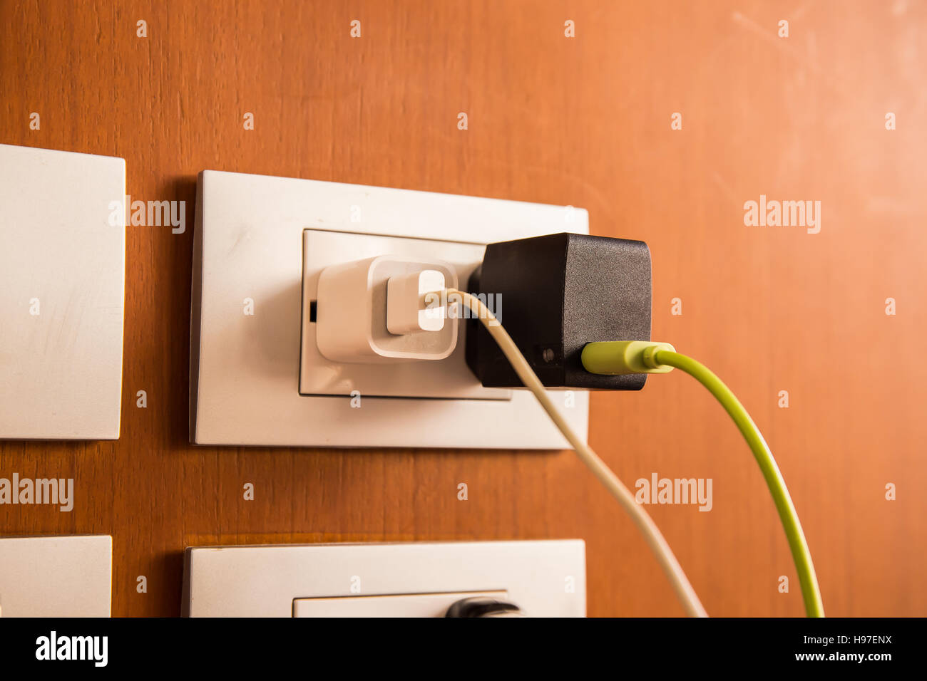 Plug the battery charger Stock Photo - Alamy