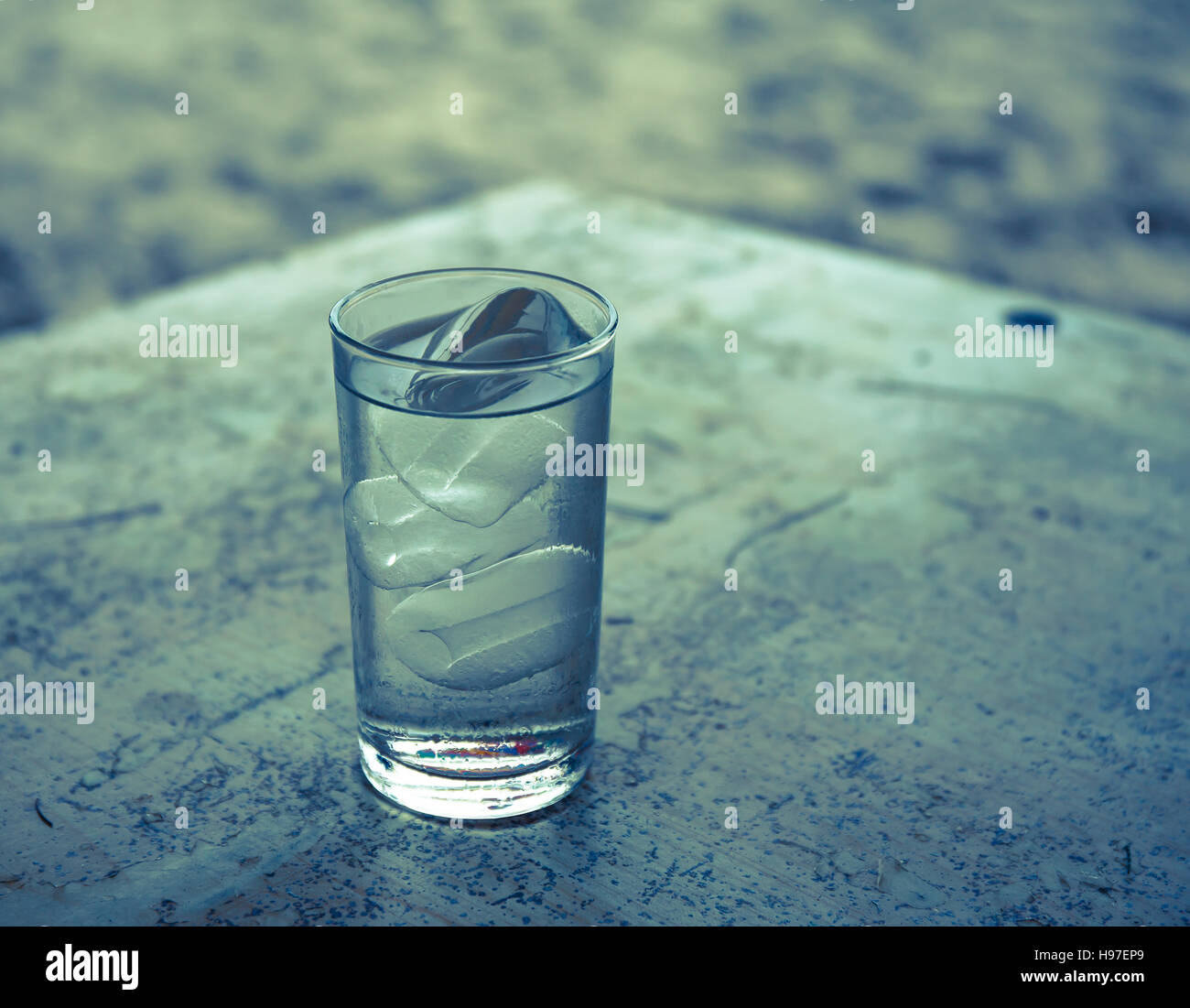 Glass of ice water on the table Stock Photo - Alamy