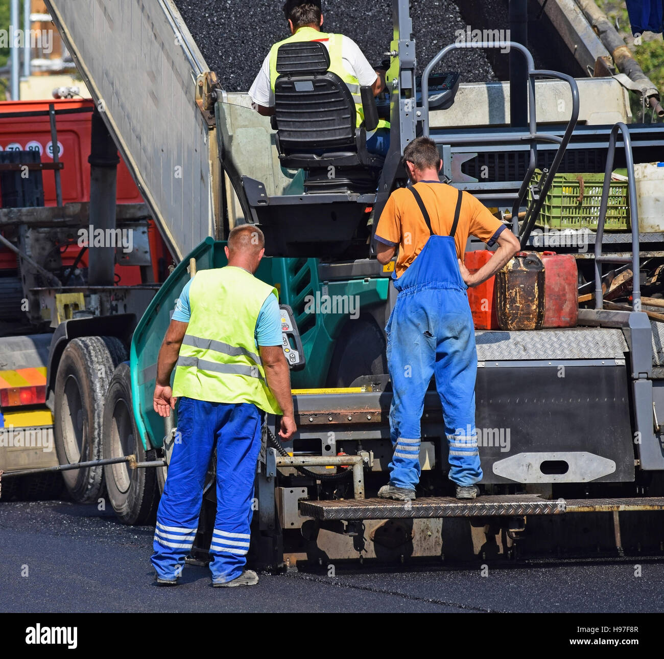 Asphalt paving vehicle at the road construction in the city Stock Photo ...