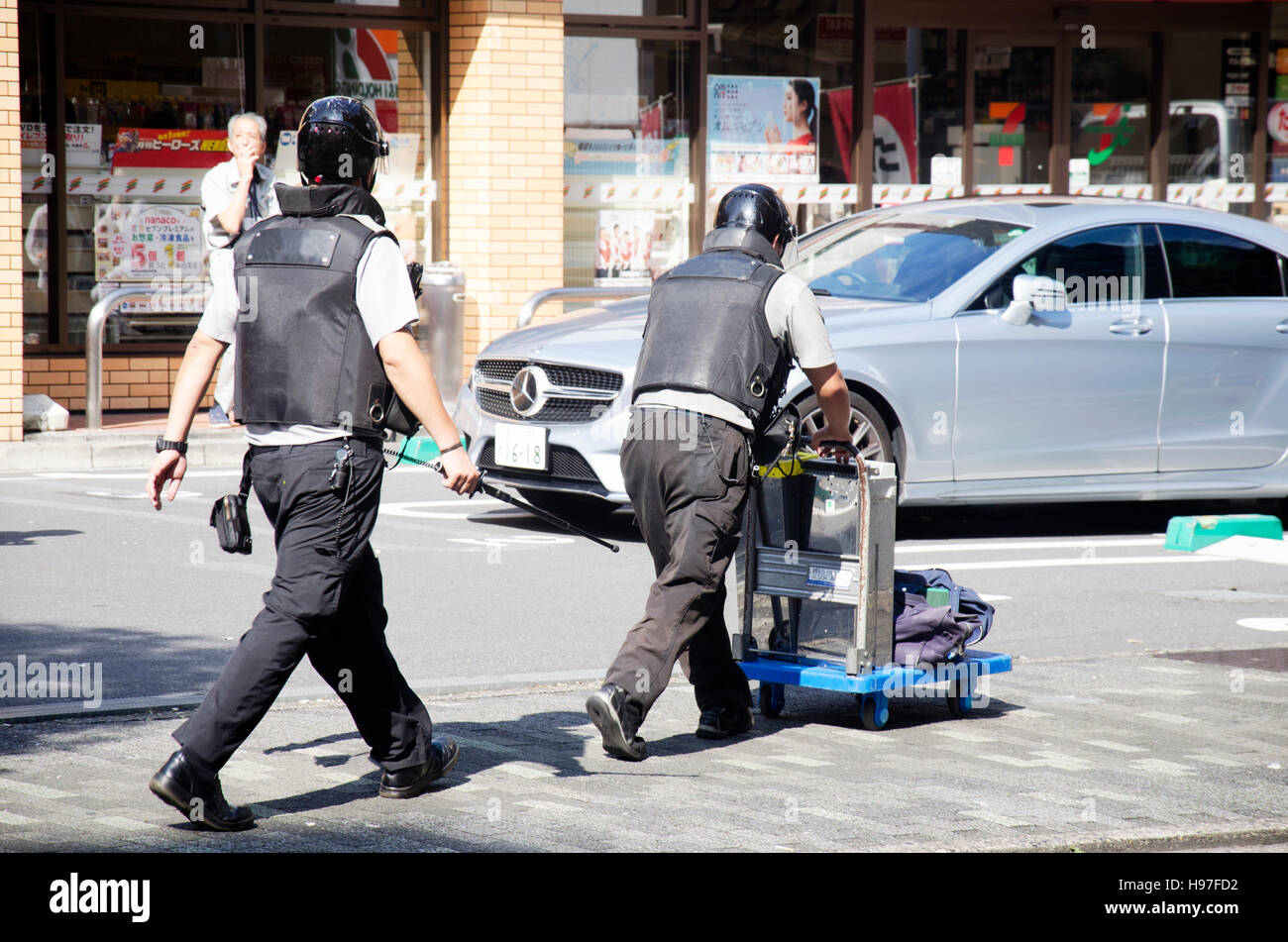Japanese people armored guard transporting money or security guard for ...