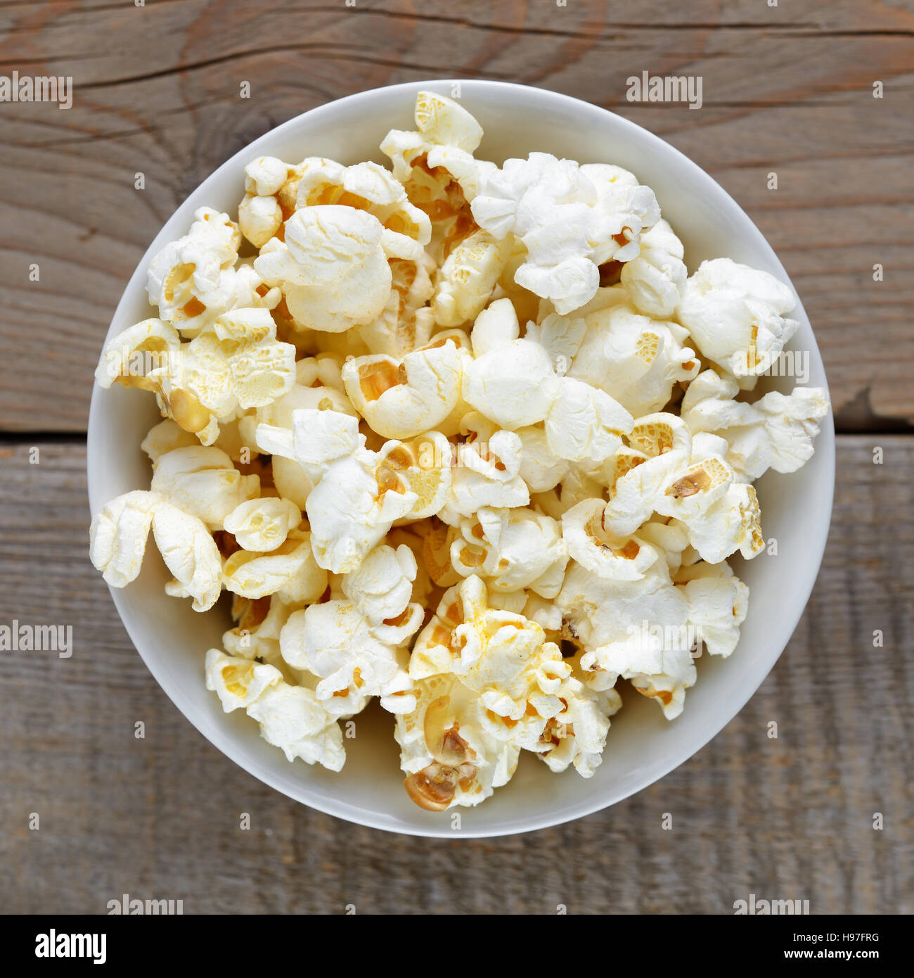 Popcorn close-up in bowl top view Stock Photo - Alamy