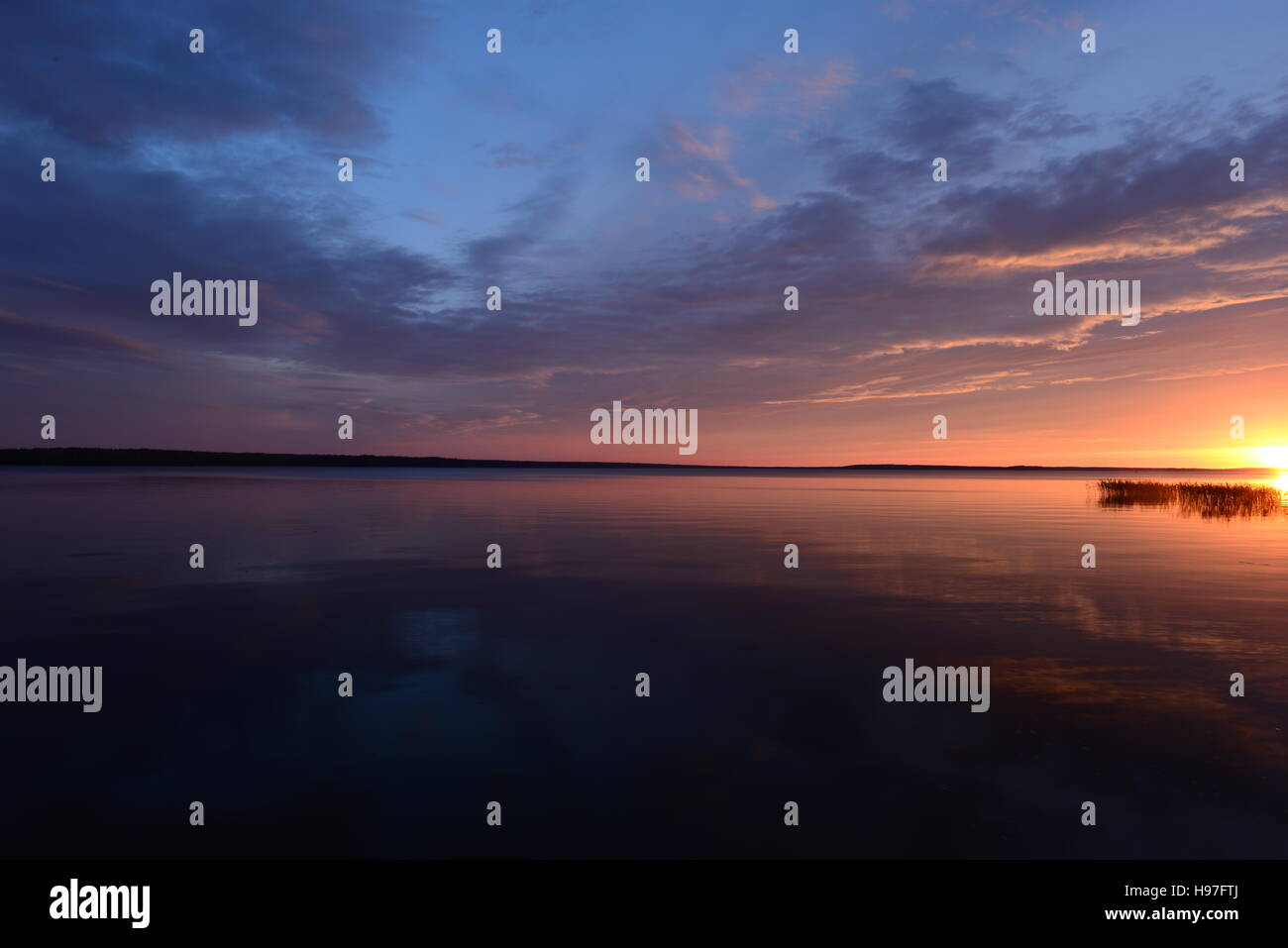 Evening sky at sunset over the lake water surface Stock Photo - Alamy