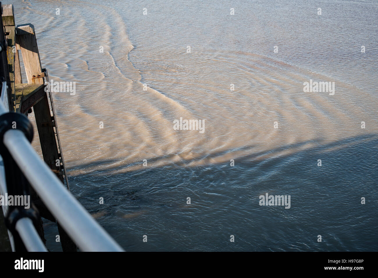 The incoming tide on the seafront in Worthing, West Sussex, England ...