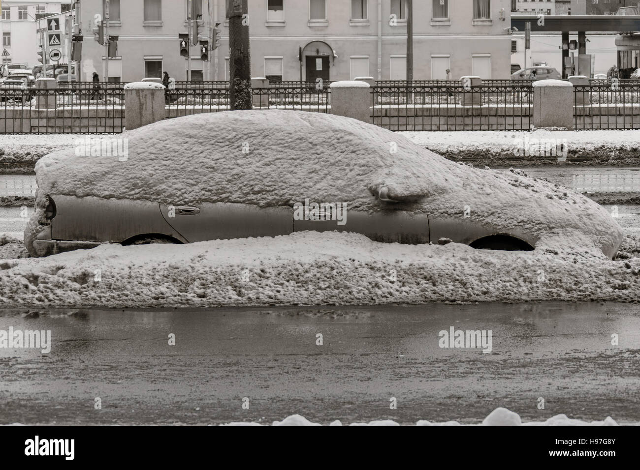 Car on winter road covered with snow side view. Vehicle on snowy alley ...