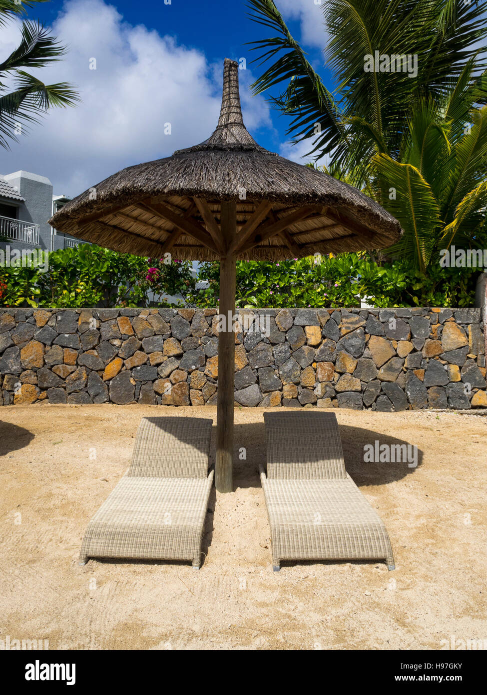 Sun loungers on the beach, Pointe aux Piments, Mauritius Stock Photo ...