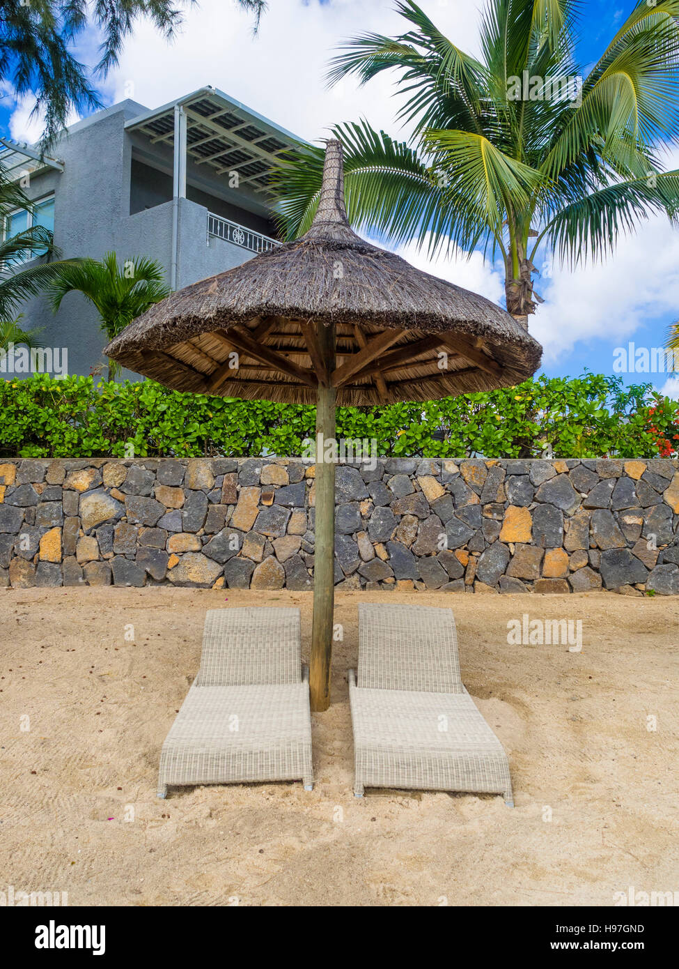 Sun loungers on the beach, Pointe aux Piments, Mauritius Stock Photo ...