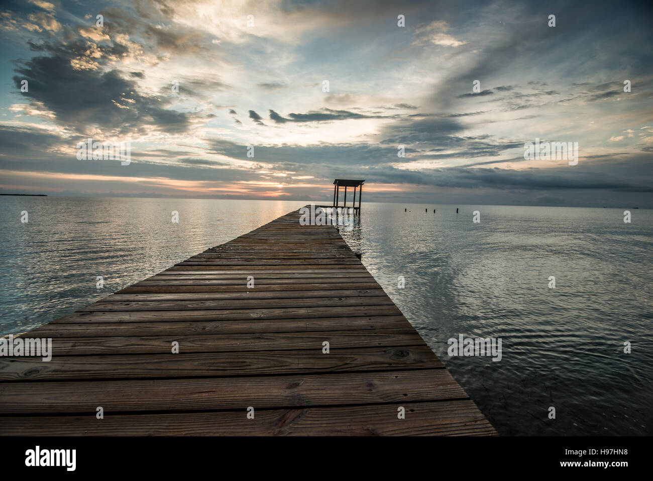 Dock in Belize at Sunrise Peaceful Stock Photo - Alamy