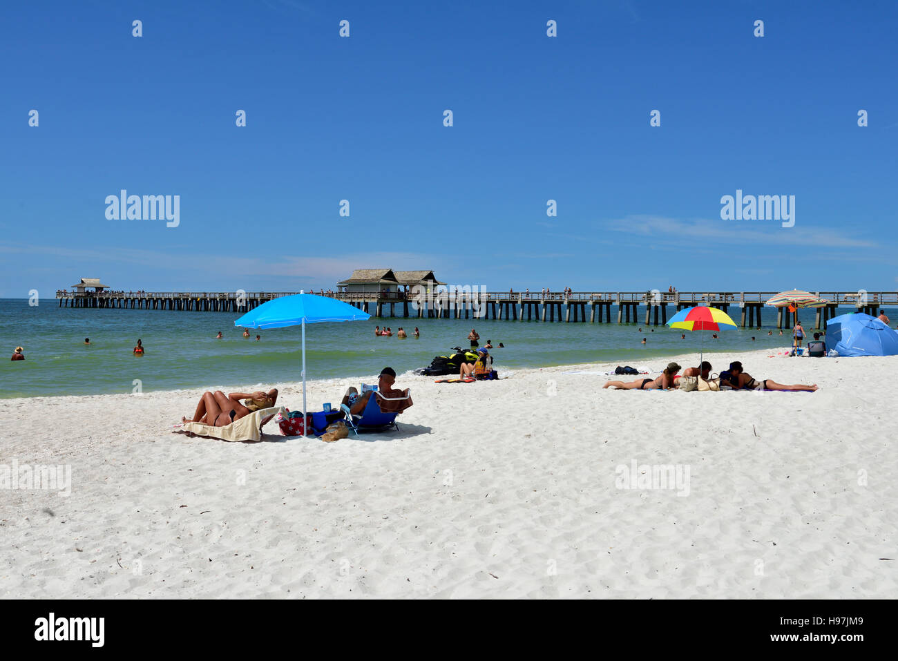 Naples, Florida, USA sandy beach and pier on the Golf Cost Stock Photo ...
