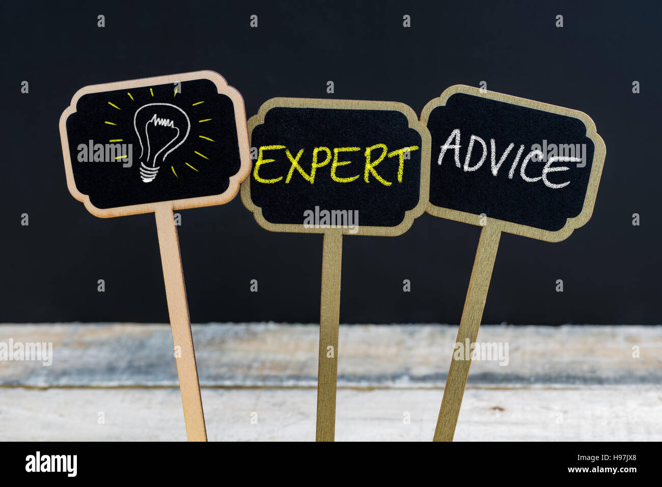 Concept message EXPERT ADVICE and light bulb as symbol for idea written ...