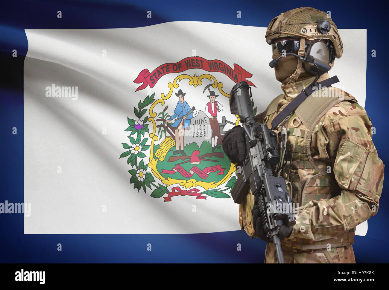 Soldier in helmet holding machine gun with USA state flag on background ...