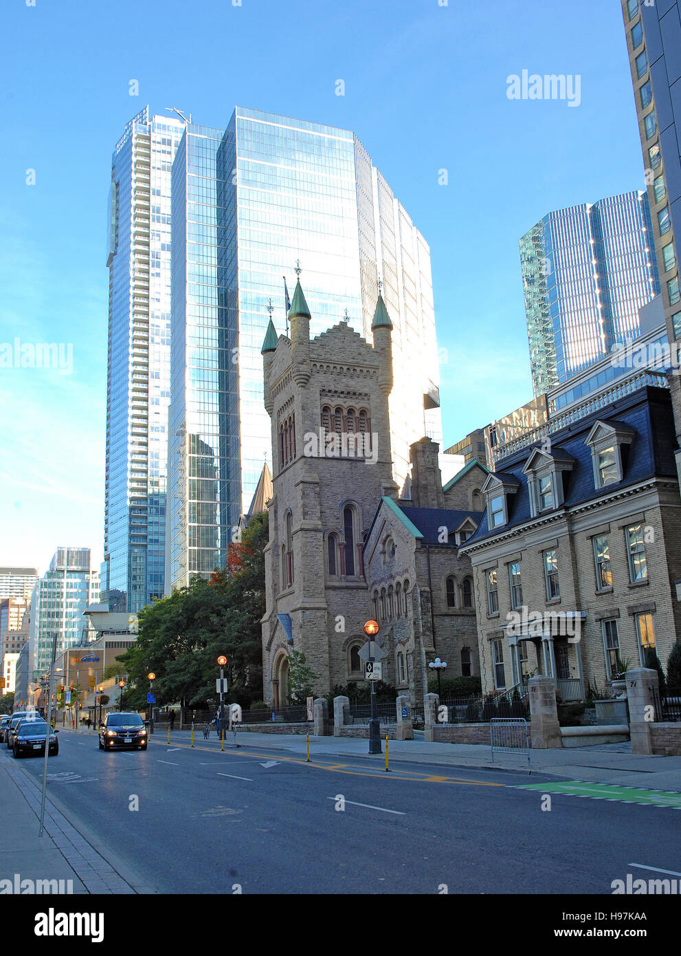 In downtown Toronto a big high rise building with an old church in ...