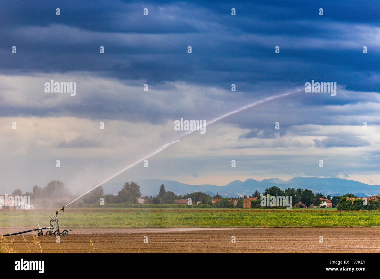 irrigation of fields with high pressure sprayer Stock Photo - Alamy