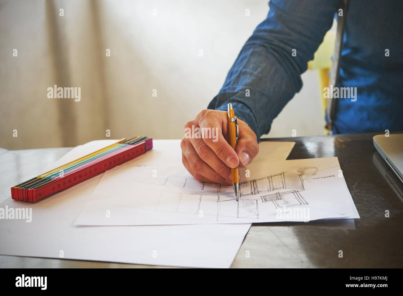 Architect man sketching a kitchen in his office Stock Photo - Alamy