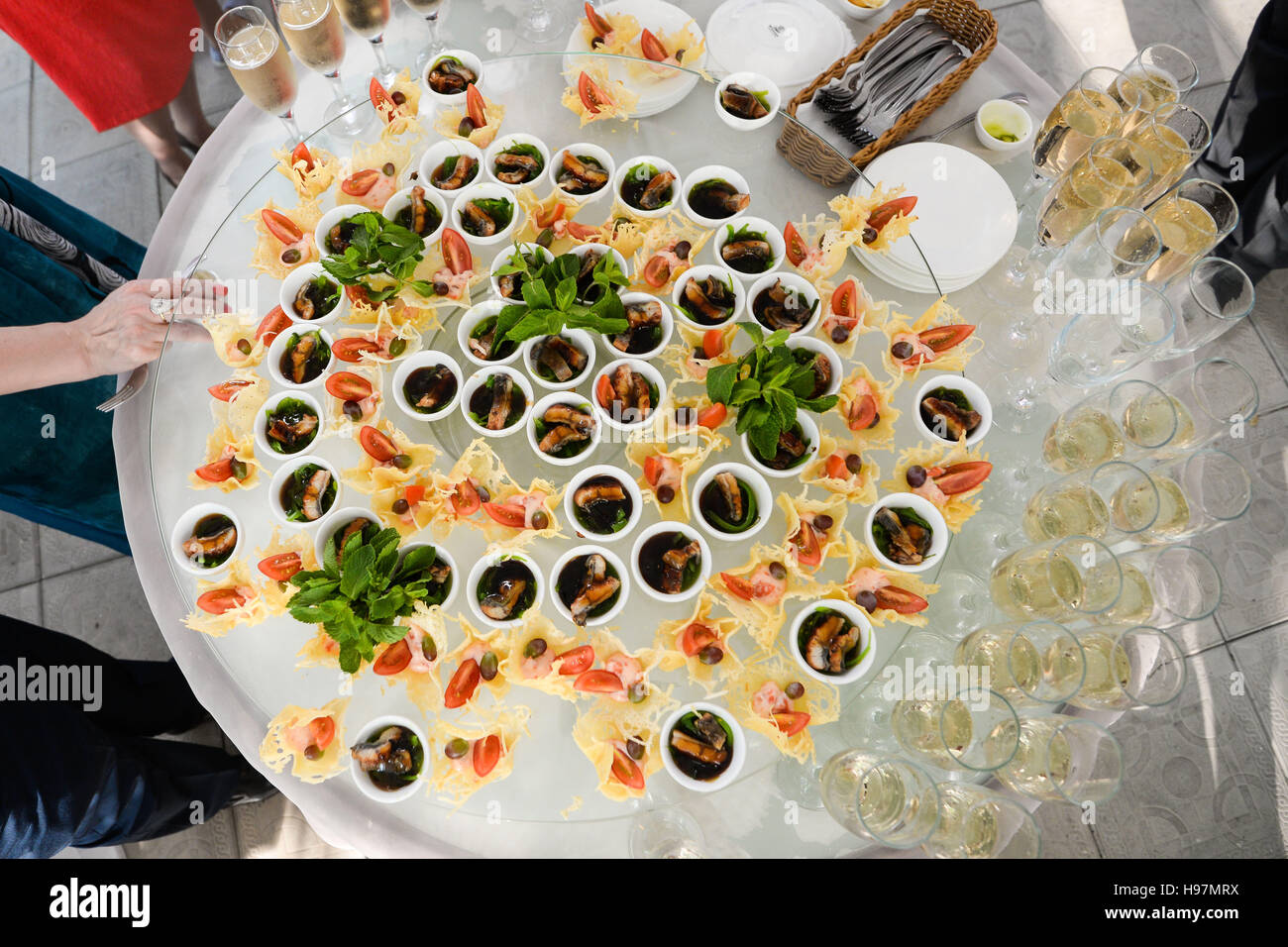 Catering service plate .appetizing sandwiches on plastic sticks ...