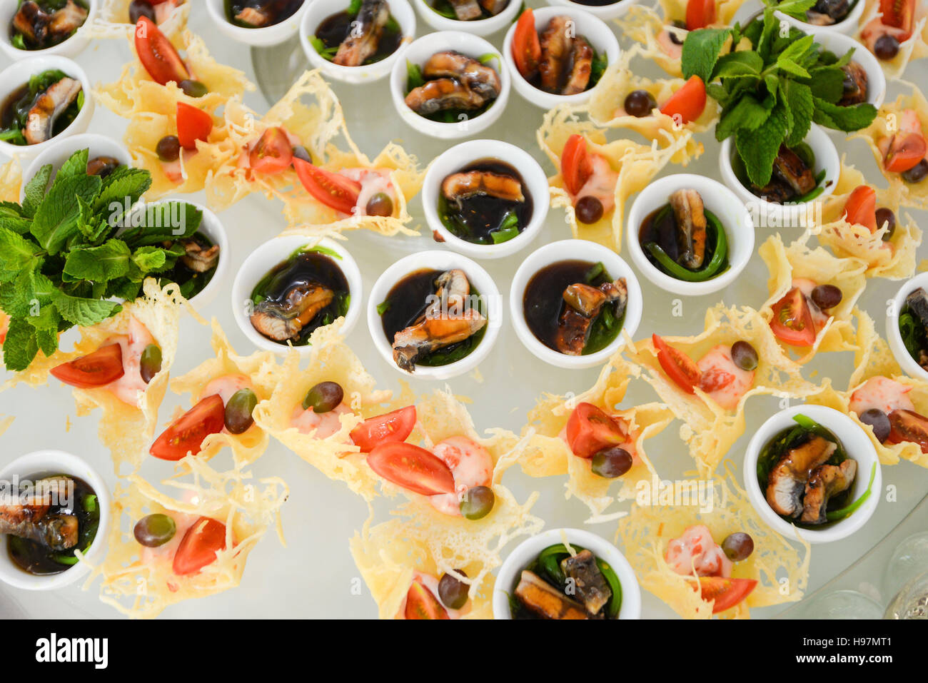 Catering service plate .appetizing sandwiches on plastic sticks ...