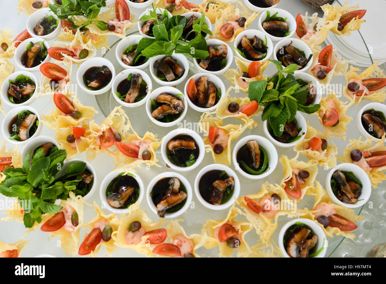 Catering service plate .appetizing sandwiches on plastic sticks ...