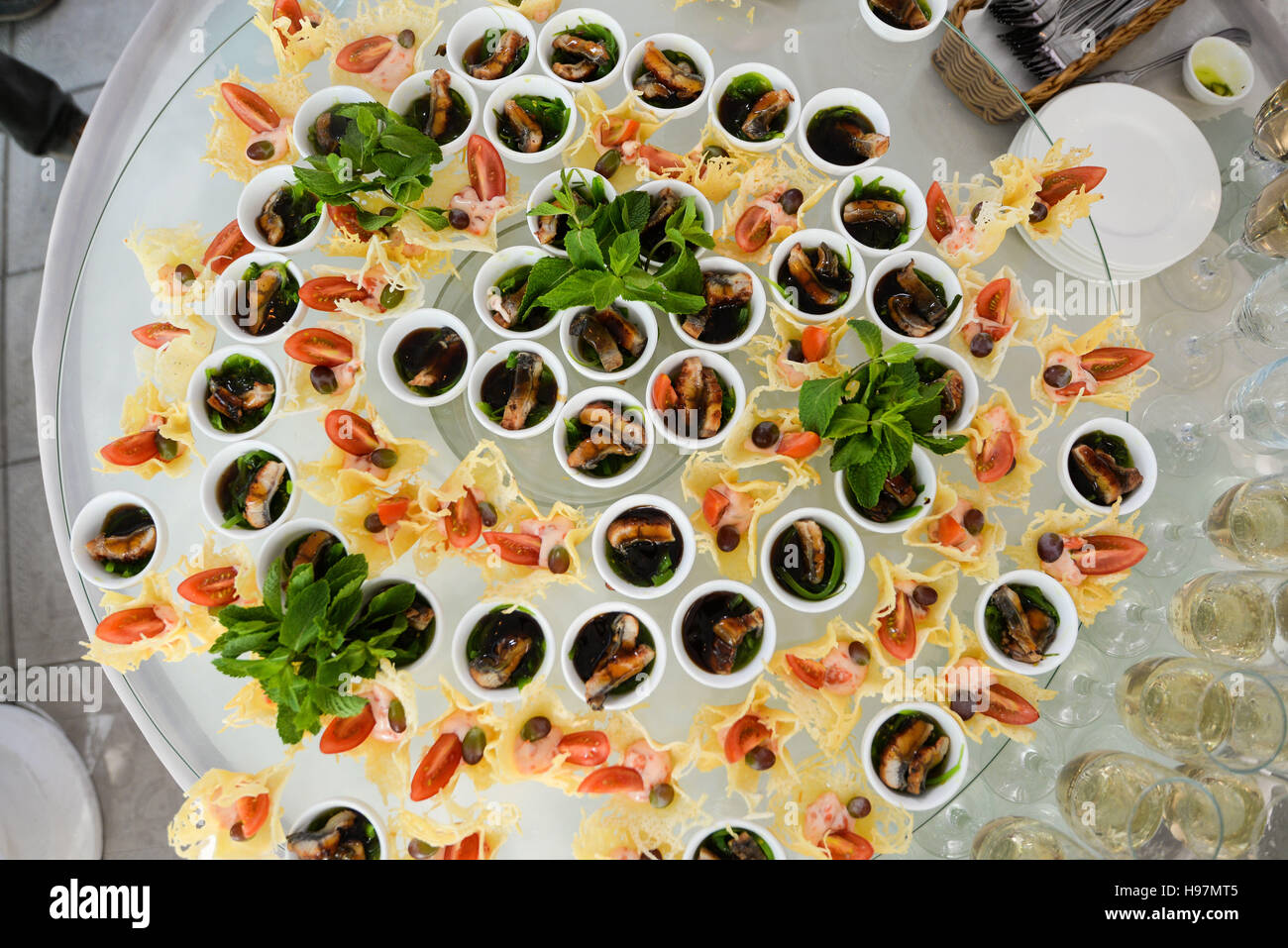 Catering service plate .appetizing sandwiches on plastic sticks ...