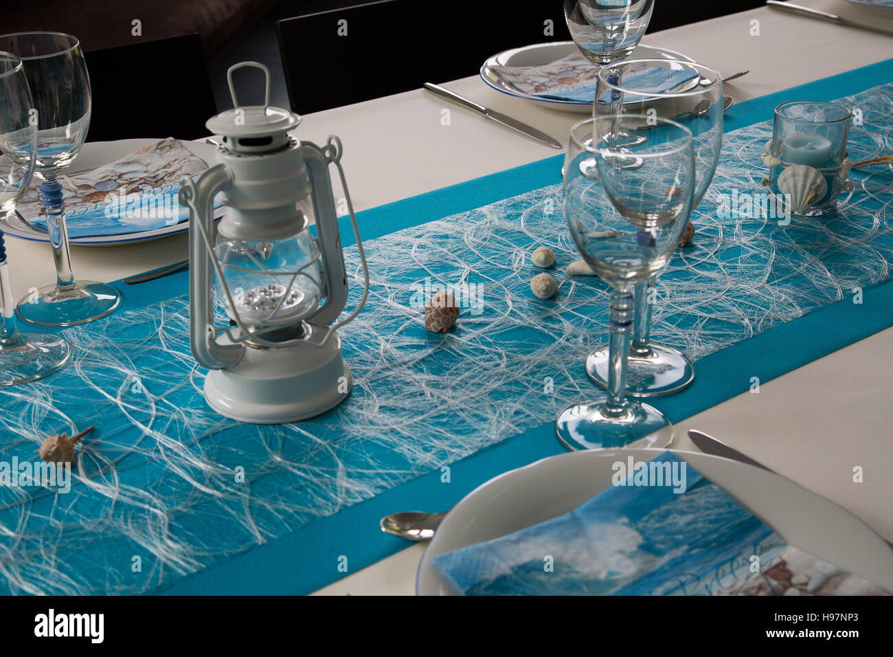 Blue table arrangement for an event party Stock Photo - Alamy