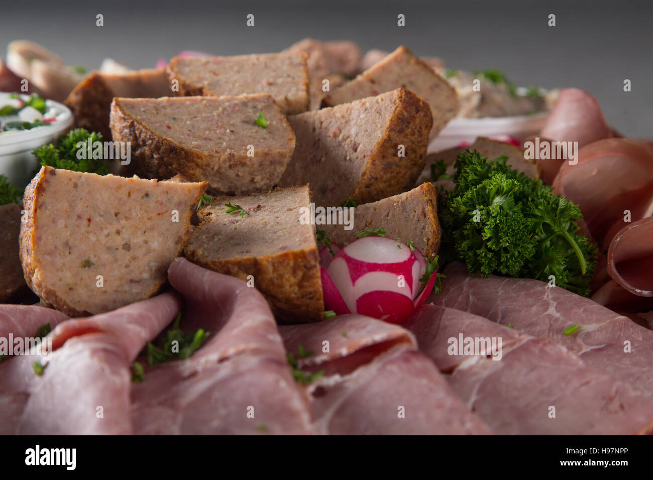 Assortment of meat delicatessen on a plate Stock Photo - Alamy
