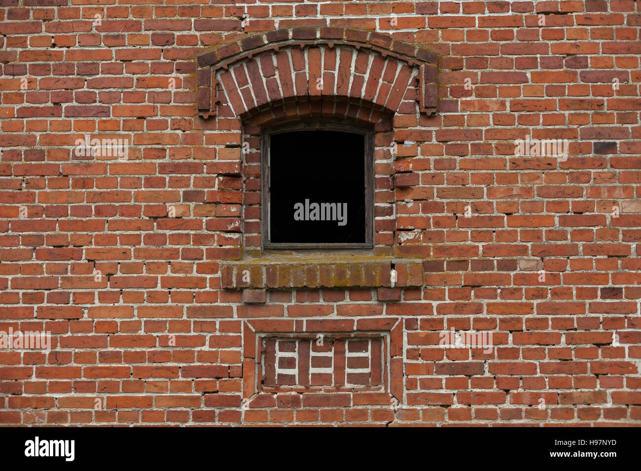 Old small window with red brick in the wall of an old warehouse Stock ...