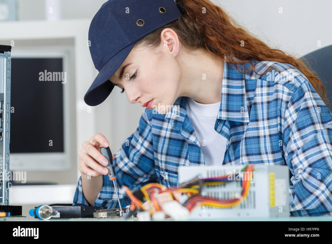 Female computer technician at work Stock Photo - Alamy