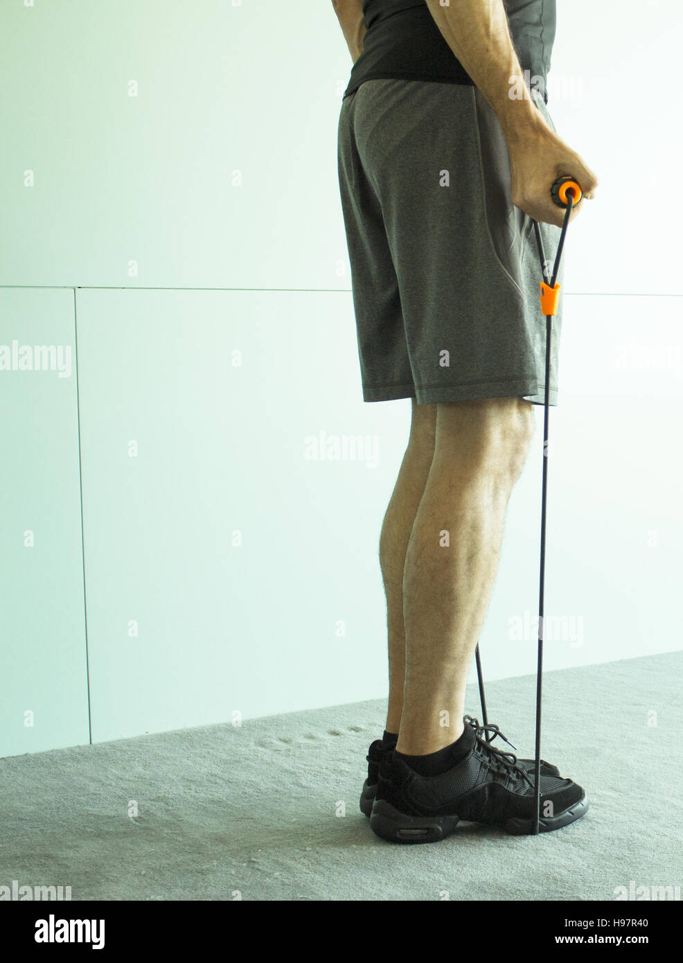 Performing exercises with resistance rope fitness Stock Photo - Alamy