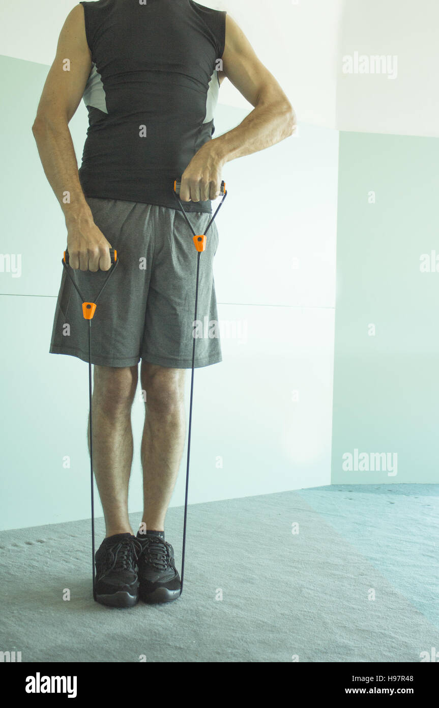 Performing exercises with resistance rope fitness Stock Photo - Alamy