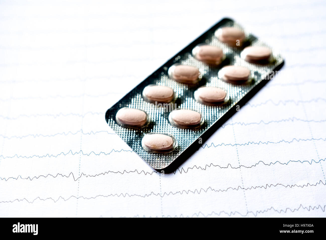 Pill on a cardiogram trace Stock Photo - Alamy