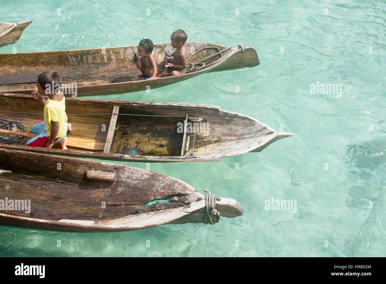 Borneo Sea Gypsy kids on a canoes in Bodgaya Mabul Sipadan Island ...