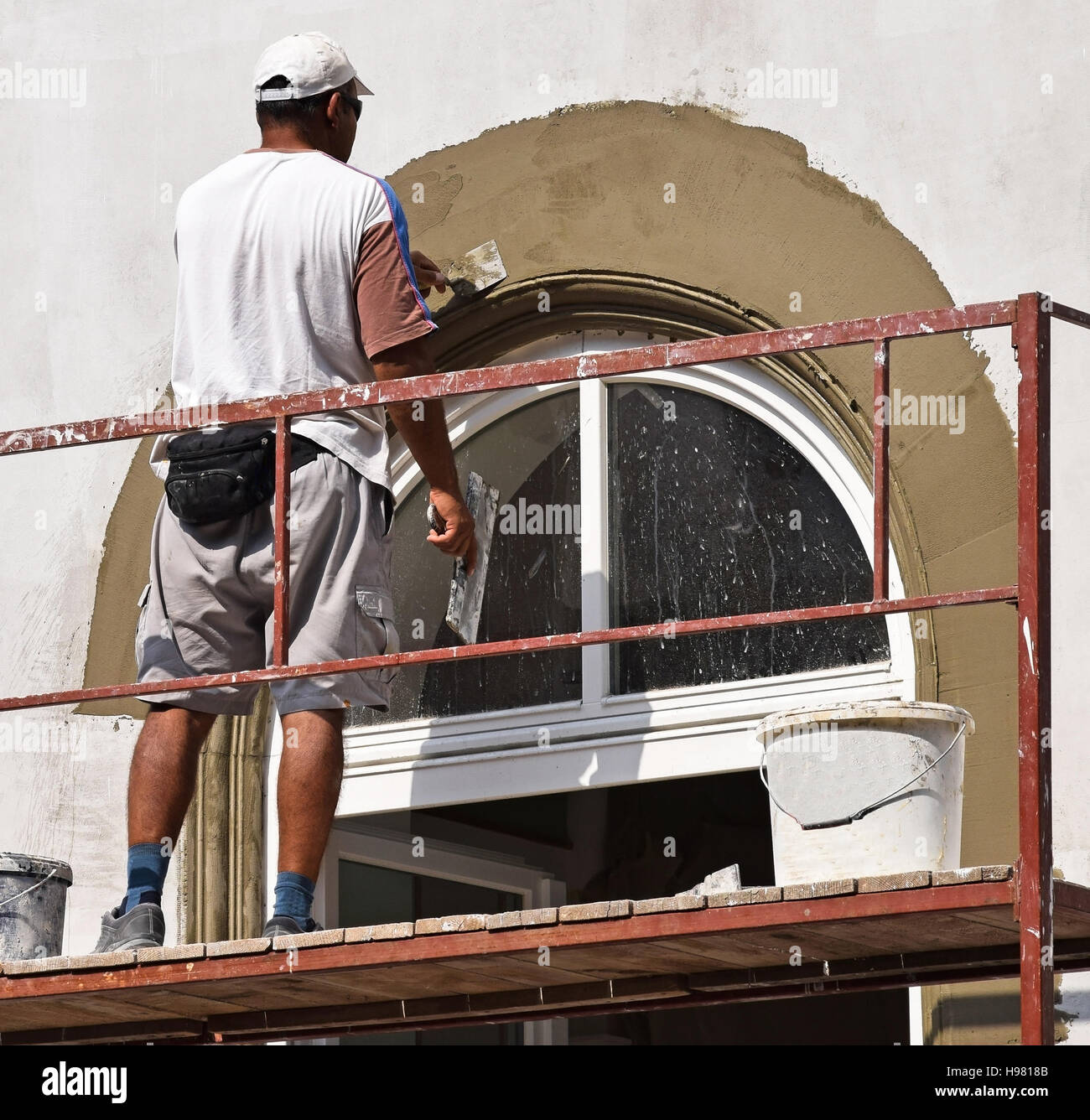 Construction worker works on a construction frame Stock Photo - Alamy