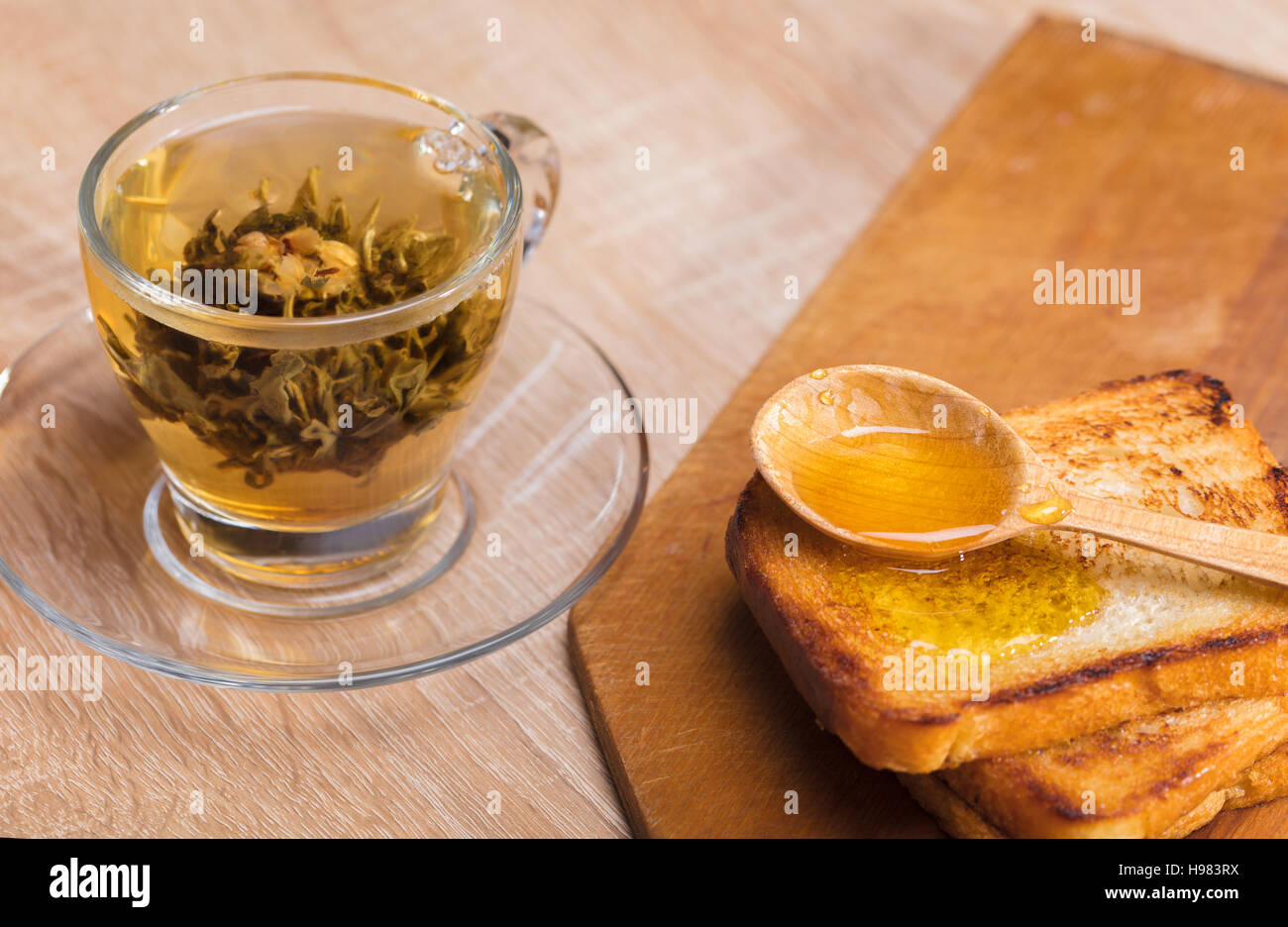 tea and toast with honey on wooden background Stock Photo - Alamy