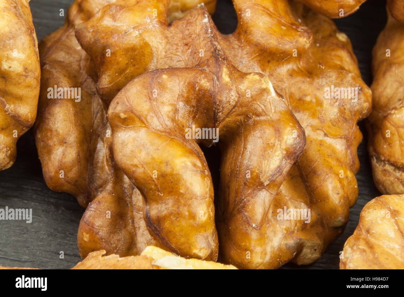 Closeup of big shelled walnuts pile. We like walnuts. Advertising on ...