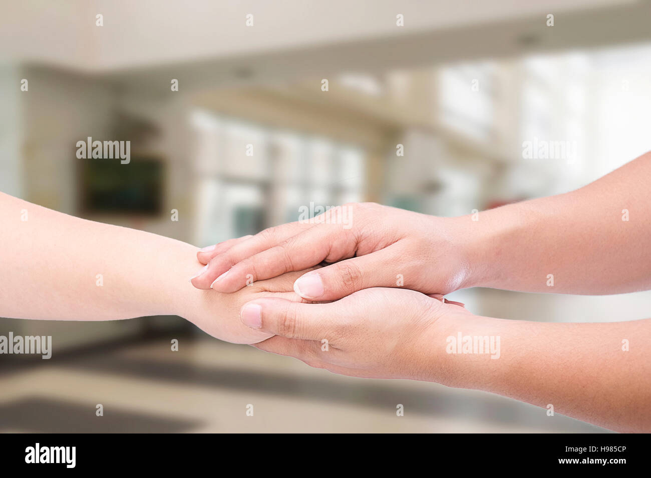 Hand of medical doctor carefully holding patient's hands Stock Photo ...