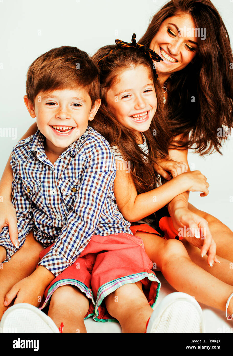 young mother with two children on white, happy smiling family in Stock ...