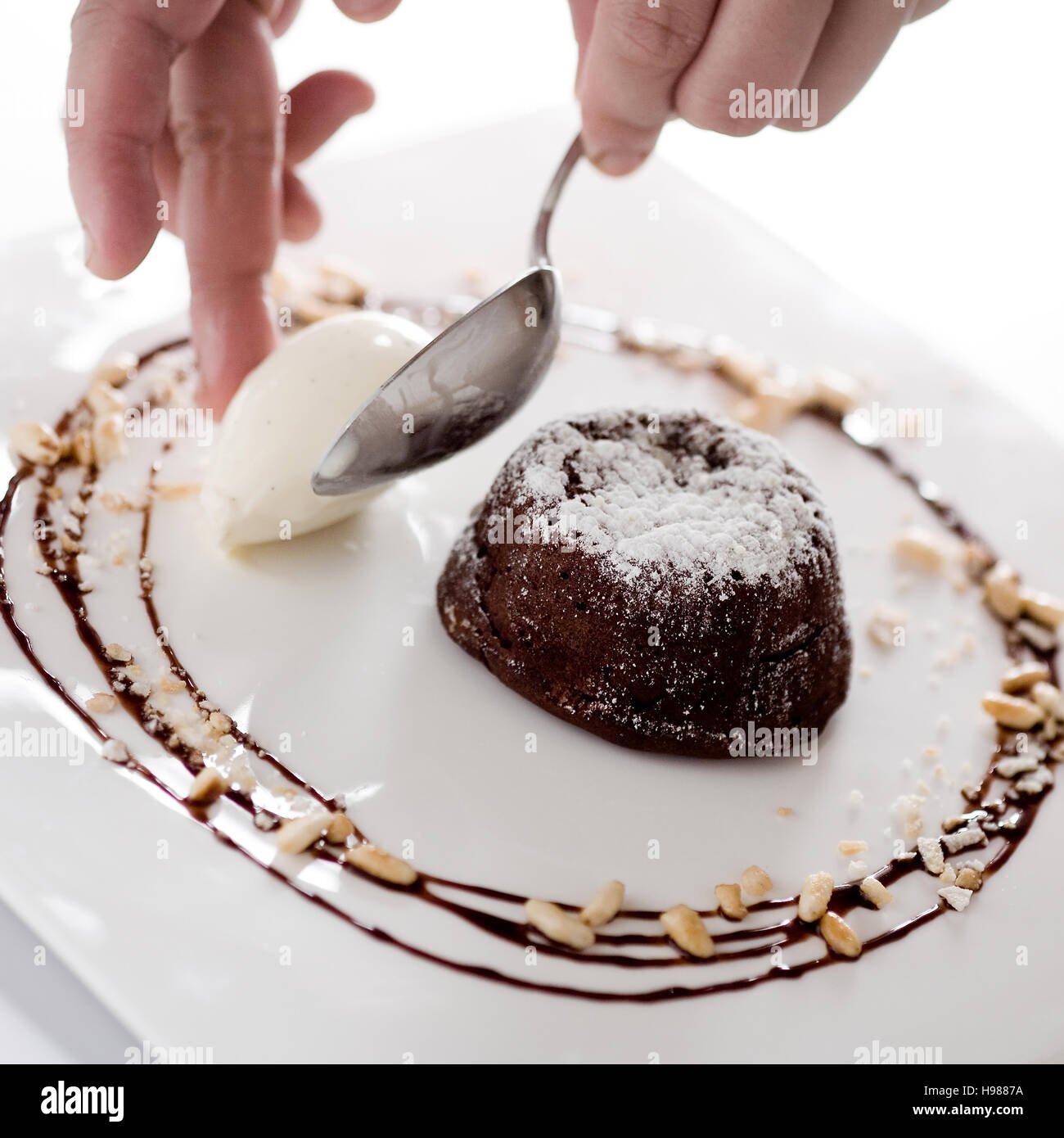 Chef is preparing dessert of Chocolate Cake with Vanilla ice cream ...