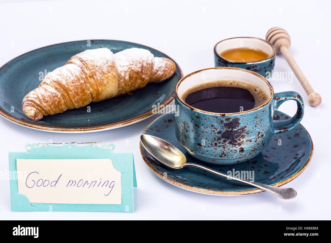 Fresh croissant with cup of hot coffee and honey for breakfast. Studio ...