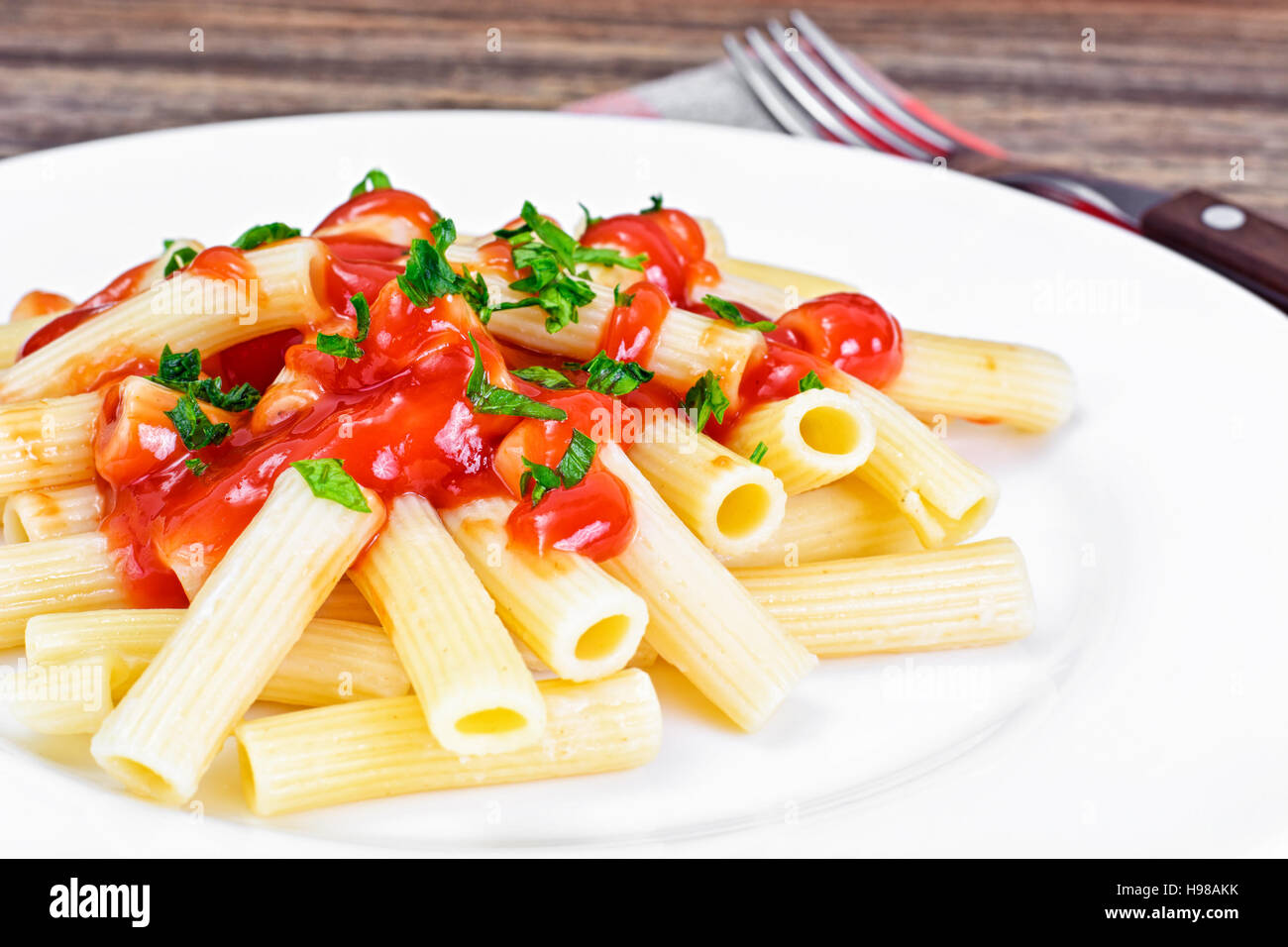 Pasta with Tomato Ketchup Sauce, Green Onions and Cheese Studio Photo ...