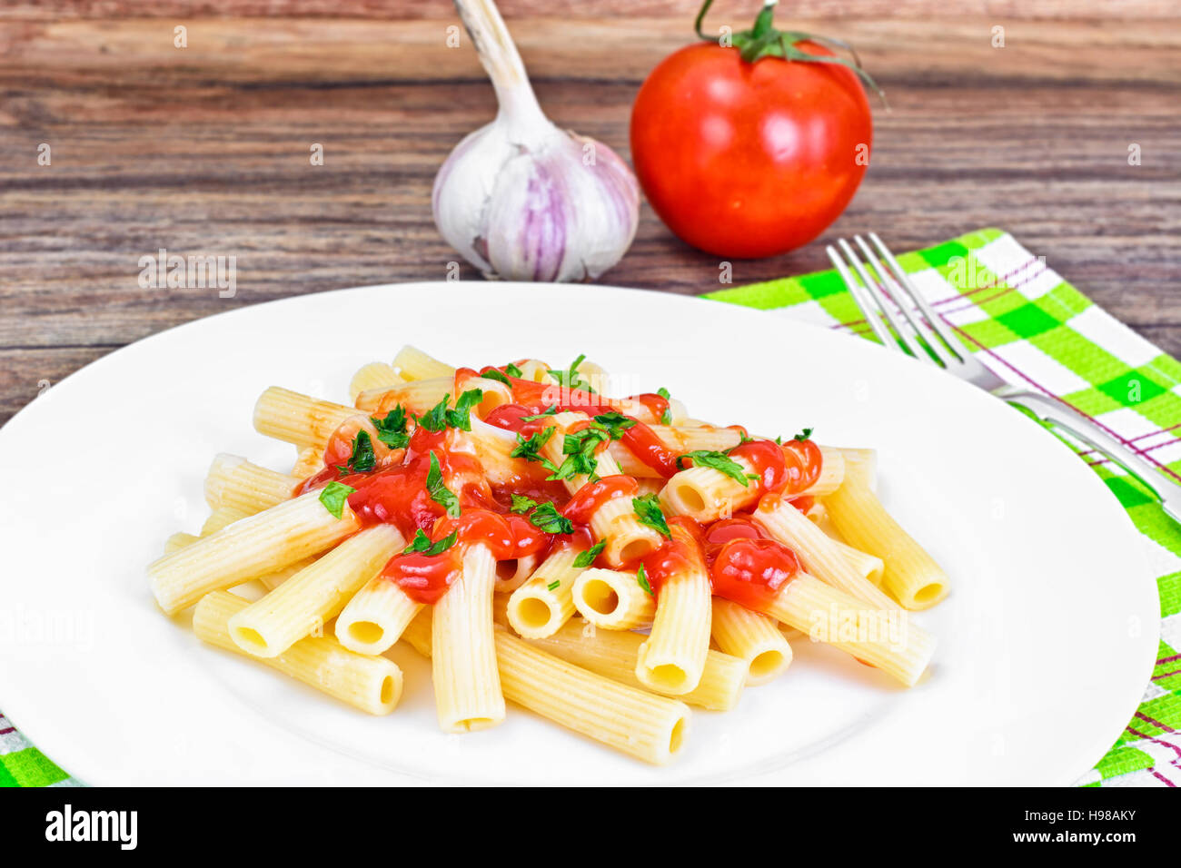 Pasta with Tomato Ketchup Sauce, Green Onions and Cheese Studio Photo ...