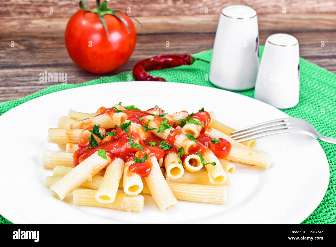 Pasta with Tomato Ketchup Sauce, Green Onions and Cheese Studio Photo ...