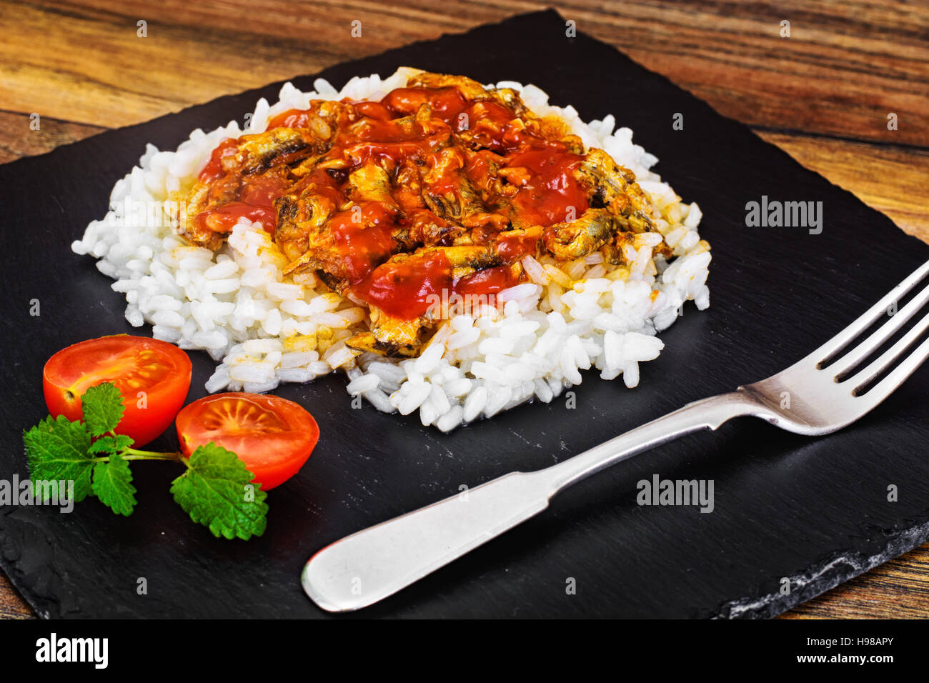 Rice with Canned Fish in Tomato Sauce Studio Photo Stock Photo - Alamy