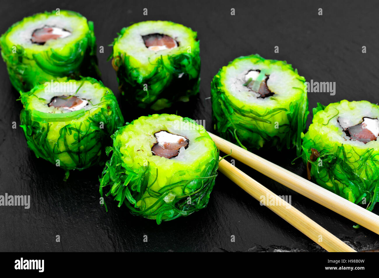 Sushi Roll with Chukoy, Salmon and Cheese. Studio Photo Stock Photo - Alamy