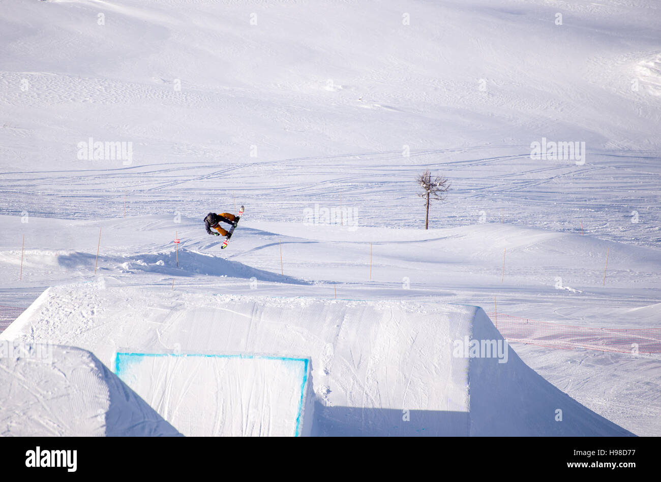 Snowboarder spinning doing a grab in the air Stock Photo - Alamy