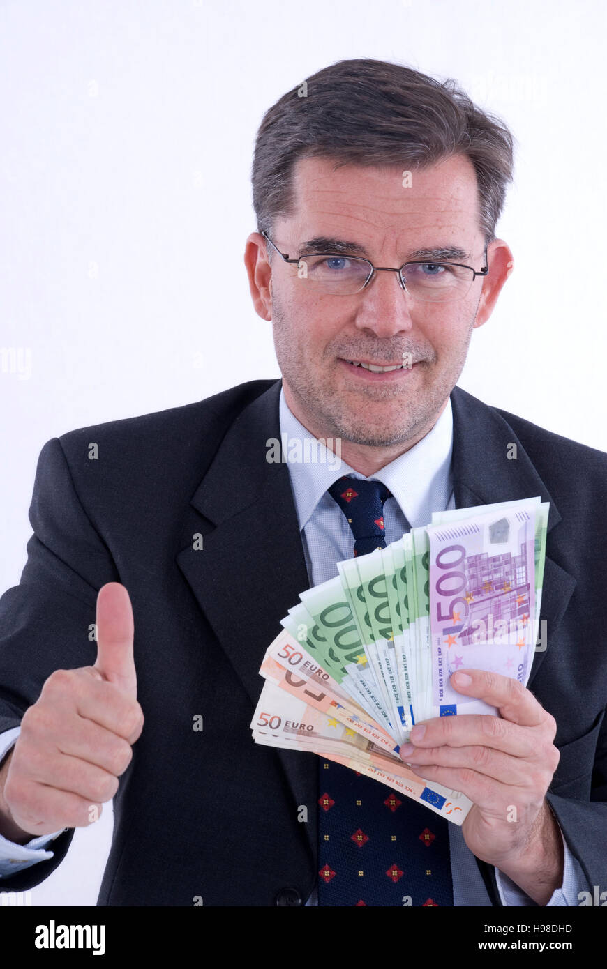 Businessman holding money Stock Photo - Alamy