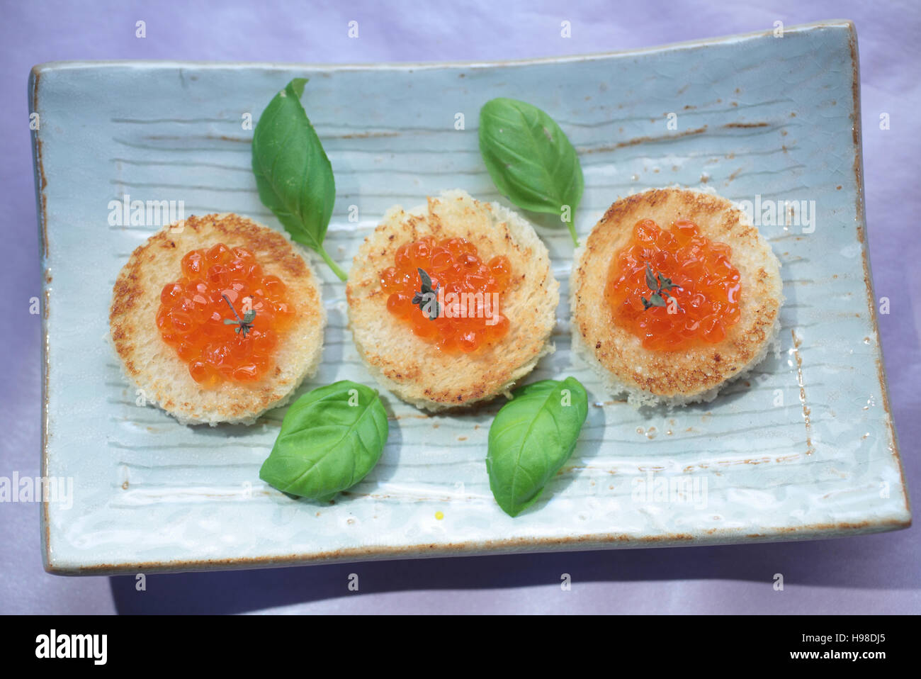 Salmon caviar on rolls Stock Photo - Alamy