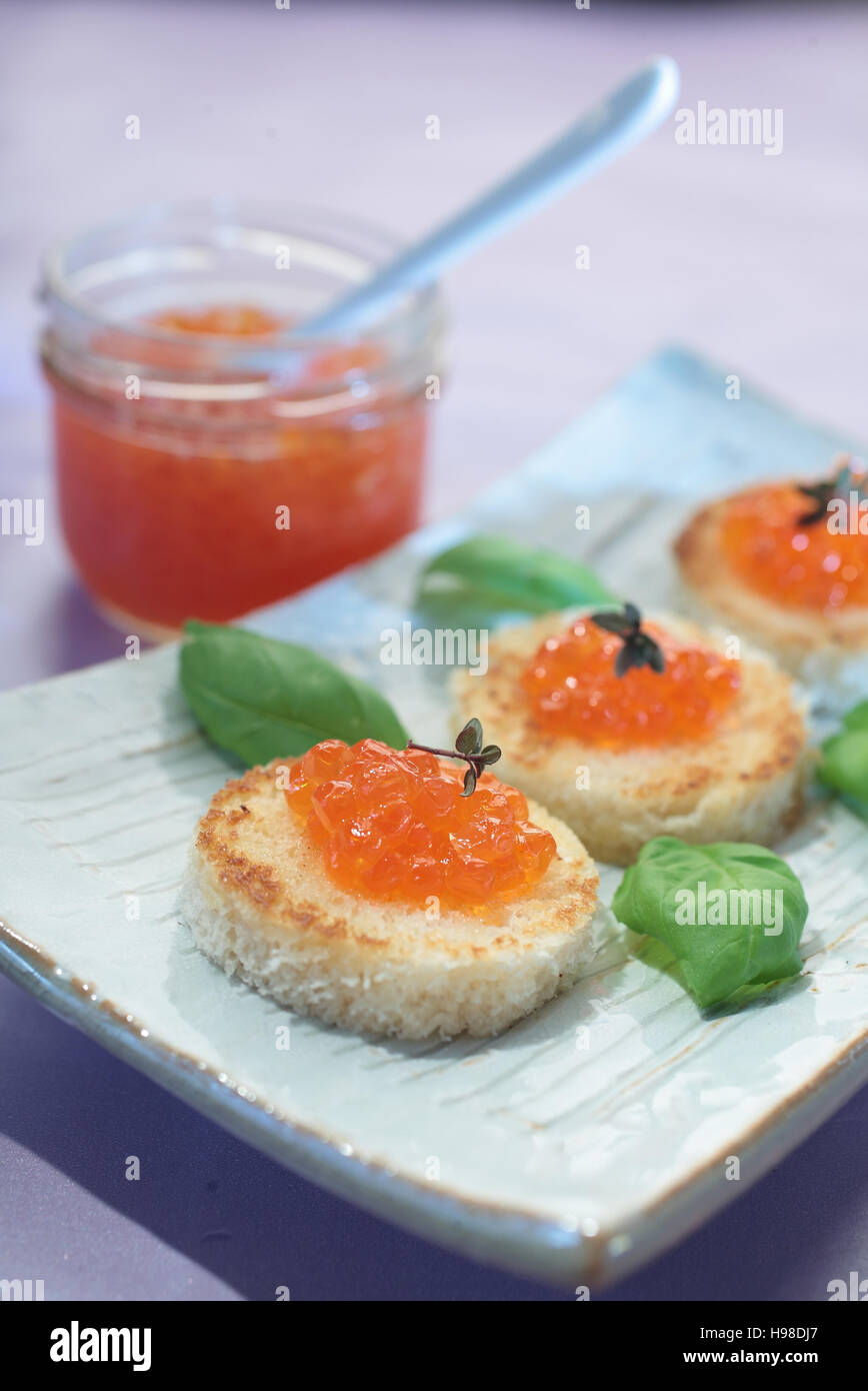 Salmon caviar on rolls Stock Photo - Alamy