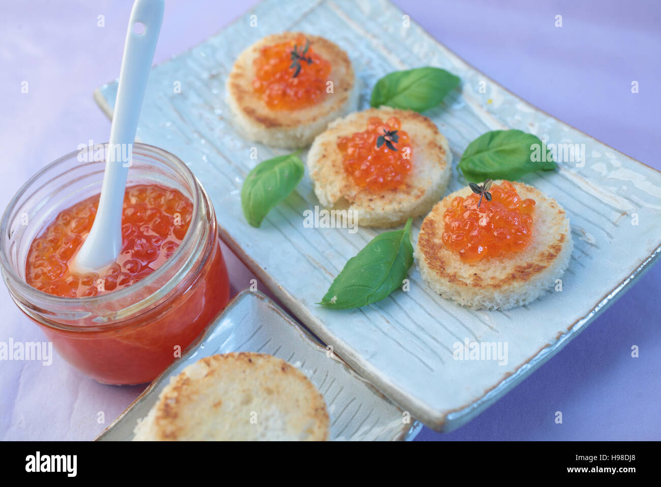 Salmon caviar on rolls Stock Photo - Alamy