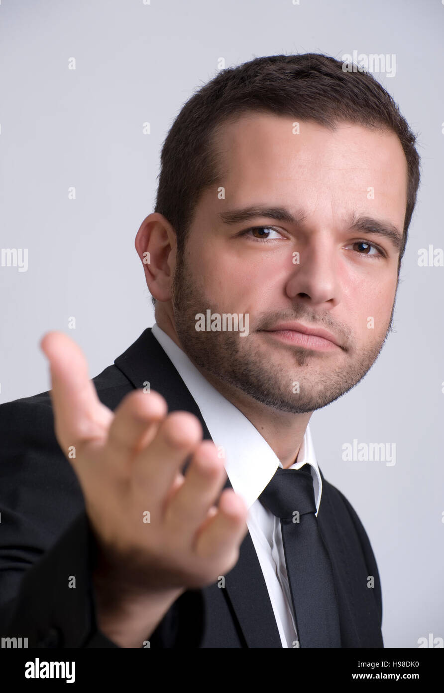 Businessman, 30+, hand towards the camera Stock Photo - Alamy