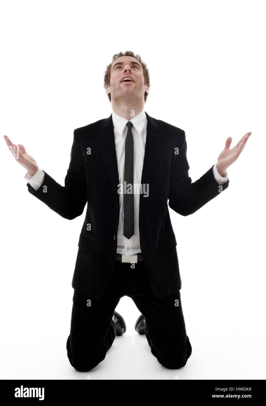 Person kneeling with arm raised hi-res stock photography and images - Alamy