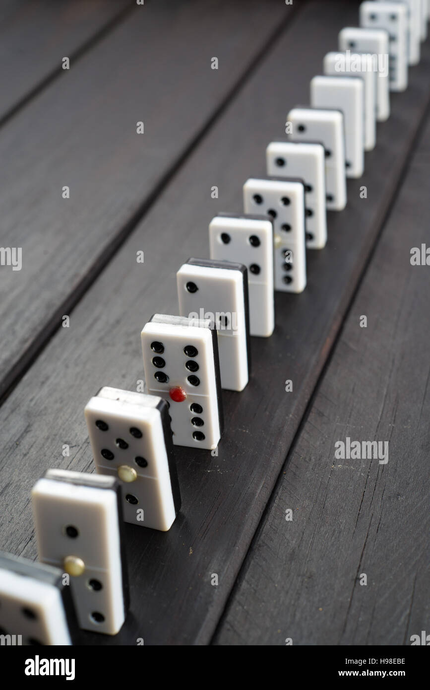 Domino game chips over black wood Stock Photo - Alamy