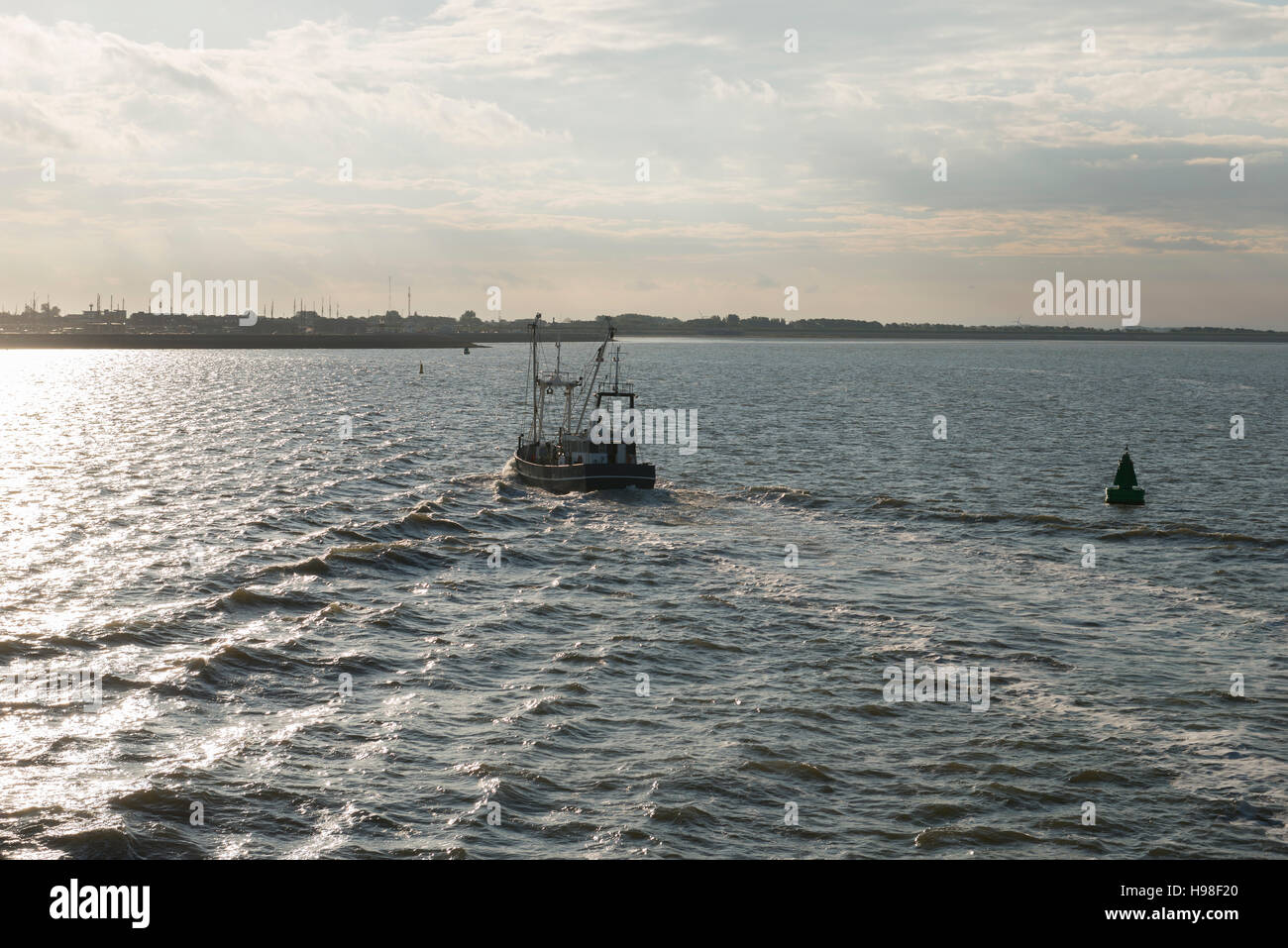 Fishing boat in the morning light on the UNESCO protected Dutch Wadden ...